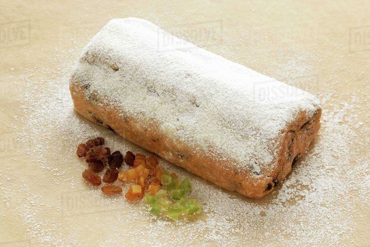 Stollen with icing sugar and ingredients - Royalty-free Stock Photo ...