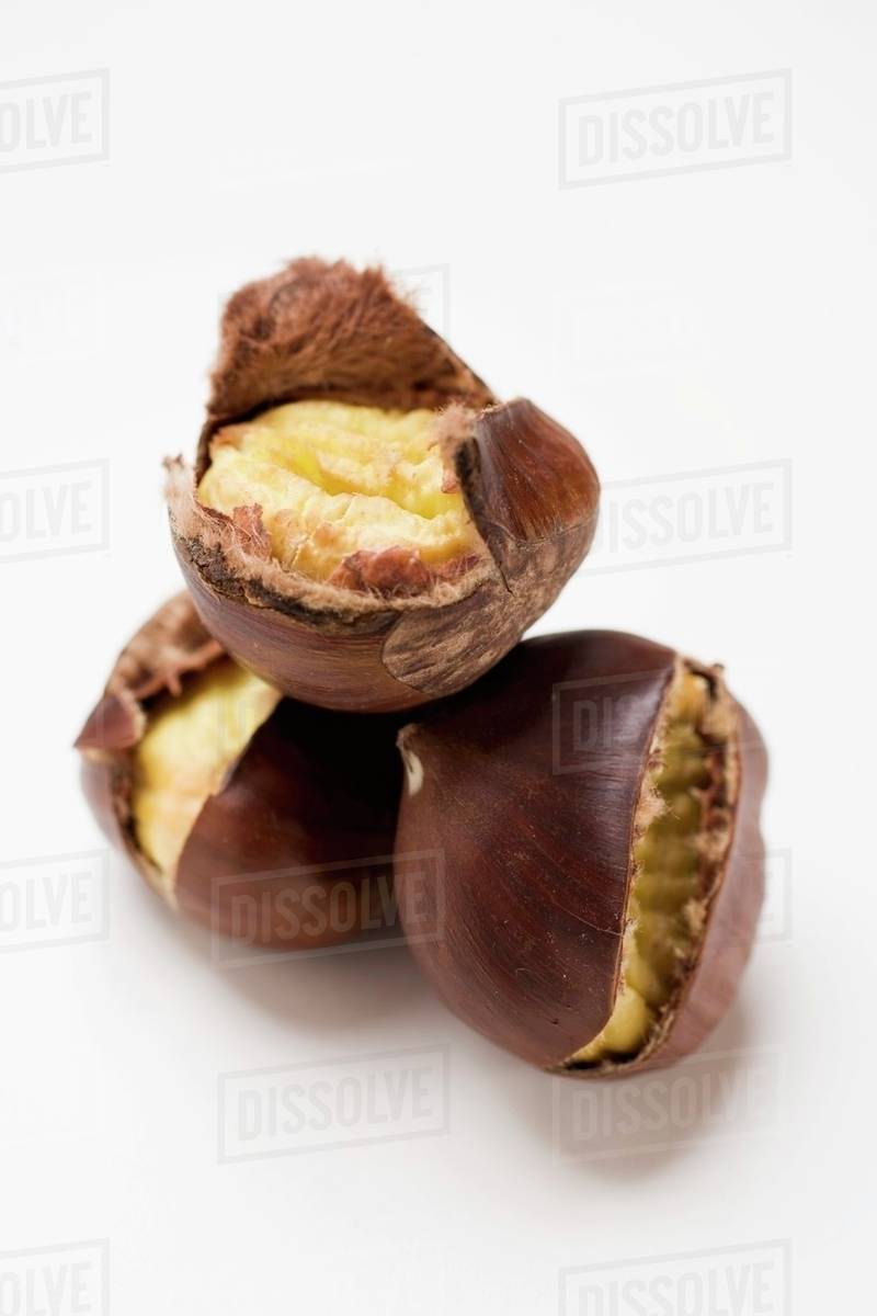 Three sweet chestnuts (roasted) - Royalty-free Stock Photo | Dissolve