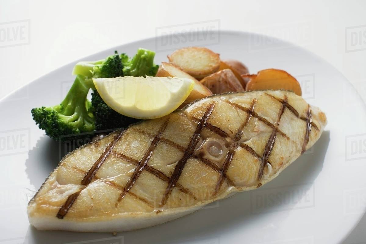 Grilled cod steak with potatoes and broccoli - Royalty-free Stock Photo ...