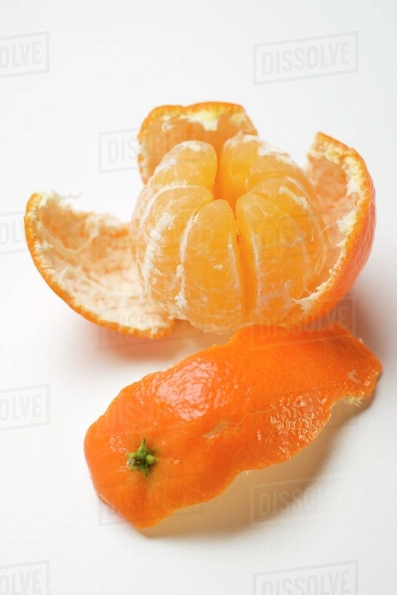 Peeled clementine - Stock Photo - Dissolve