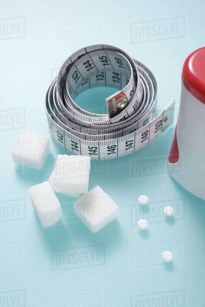 Tape measure, sweetener tablets and sugar cubes - Royalty-free Stock ...