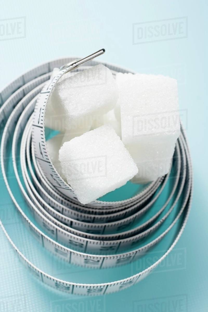 Tape measure and sugar cubes - Royalty-free Stock Photo | Dissolve