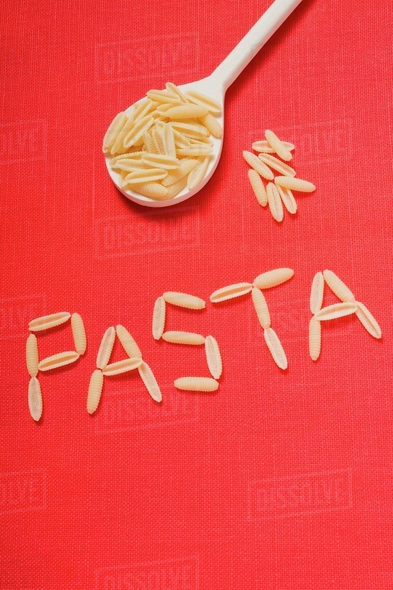 The word 'Pasta' written in pasta, pasta on wooden spoon - Stock Photo ...