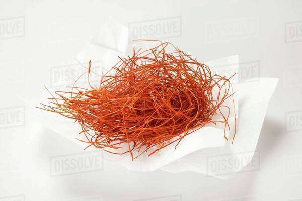 Saffron threads on paper - Royalty-free Stock Photo | Dissolve