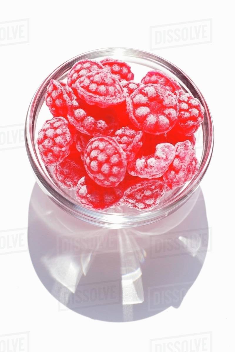 Raspberry sweets in a small glass bowl - Royalty-free Stock Photo ...