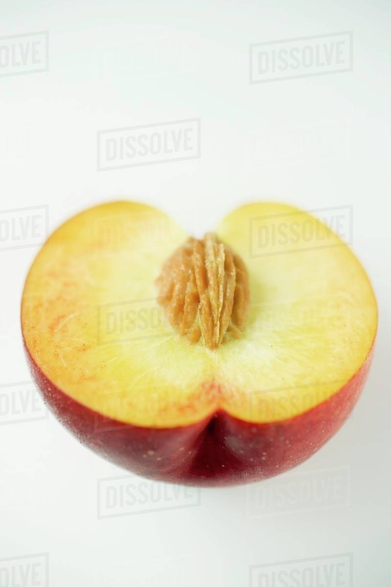 Half a nectarine - Royalty-free Stock Photo | Dissolve