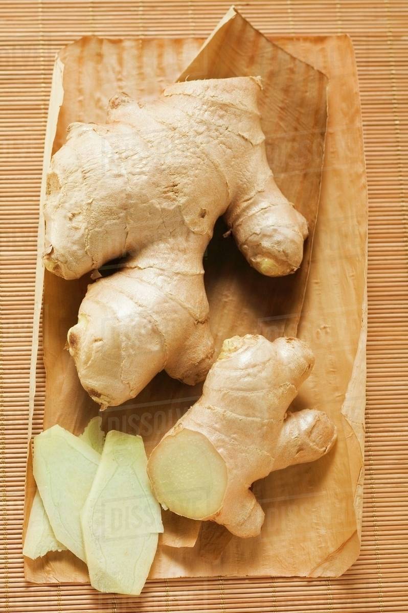 Ginger roots on paper - Royalty-free Stock Photo | Dissolve
