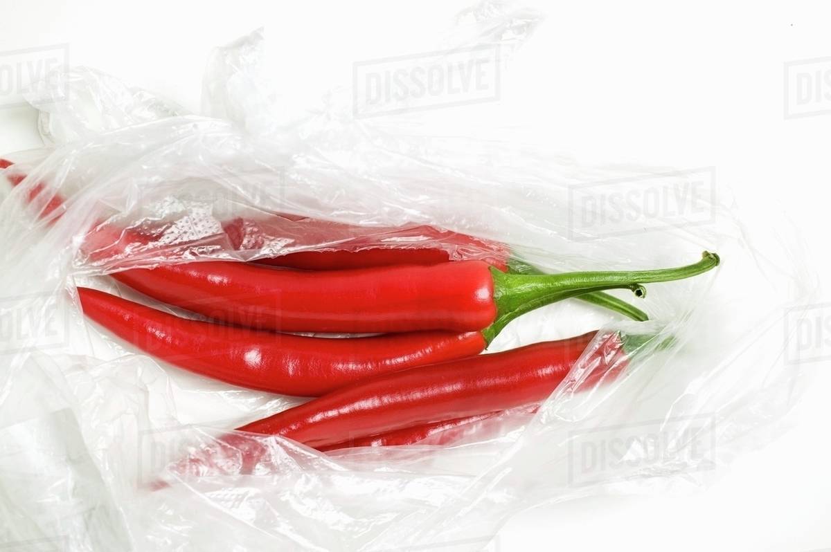 Fresh chili peppers in plastic bag - Royalty-free Stock Photo | Dissolve