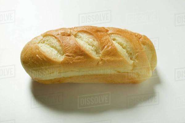 A bloomer (crusty white loaf) - Stock Photo - Dissolve