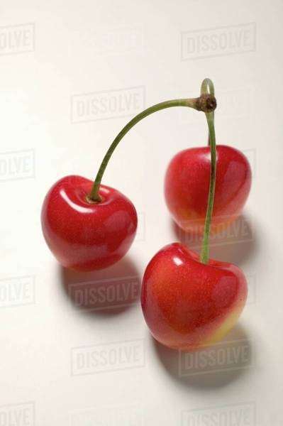 Three cherries - Royalty-free Stock Photo | Dissolve