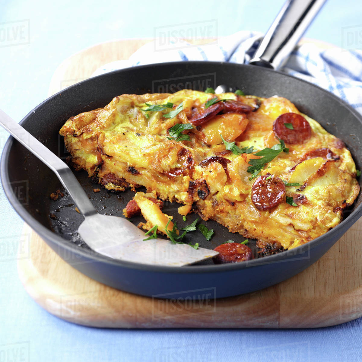 Potato tortilla with chorizo in frying pan - Royalty-free Stock Photo ...