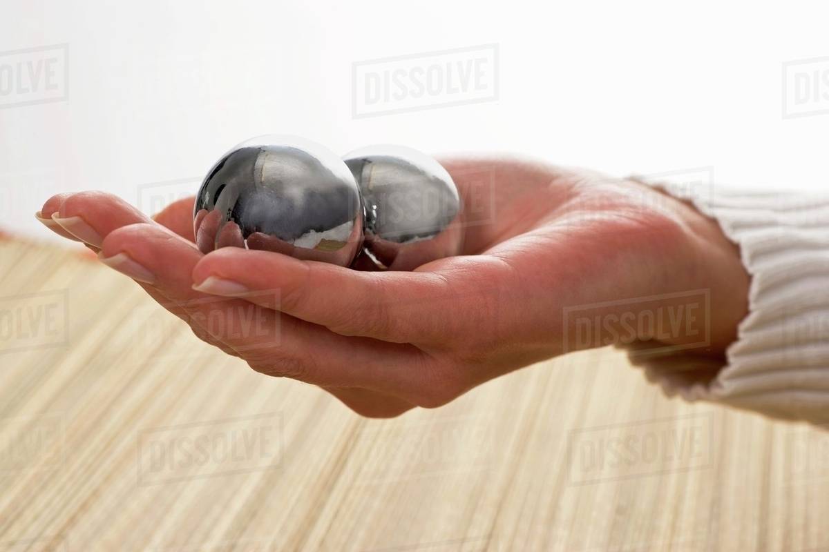 Qi Gong balls in a woman's hand - Royalty-free Stock Photo | Dissolve