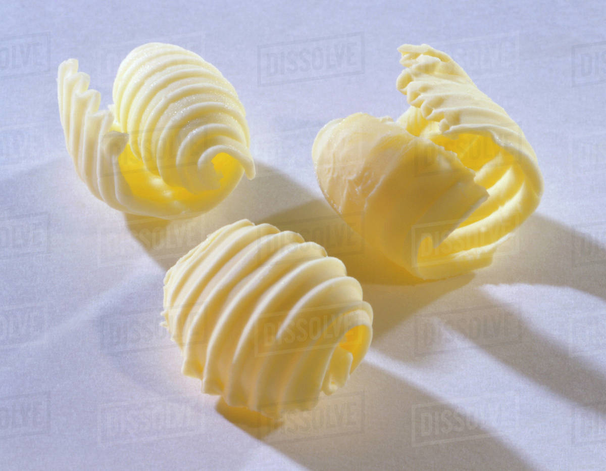 Three butter curls - Royalty-free Stock Photo | Dissolve