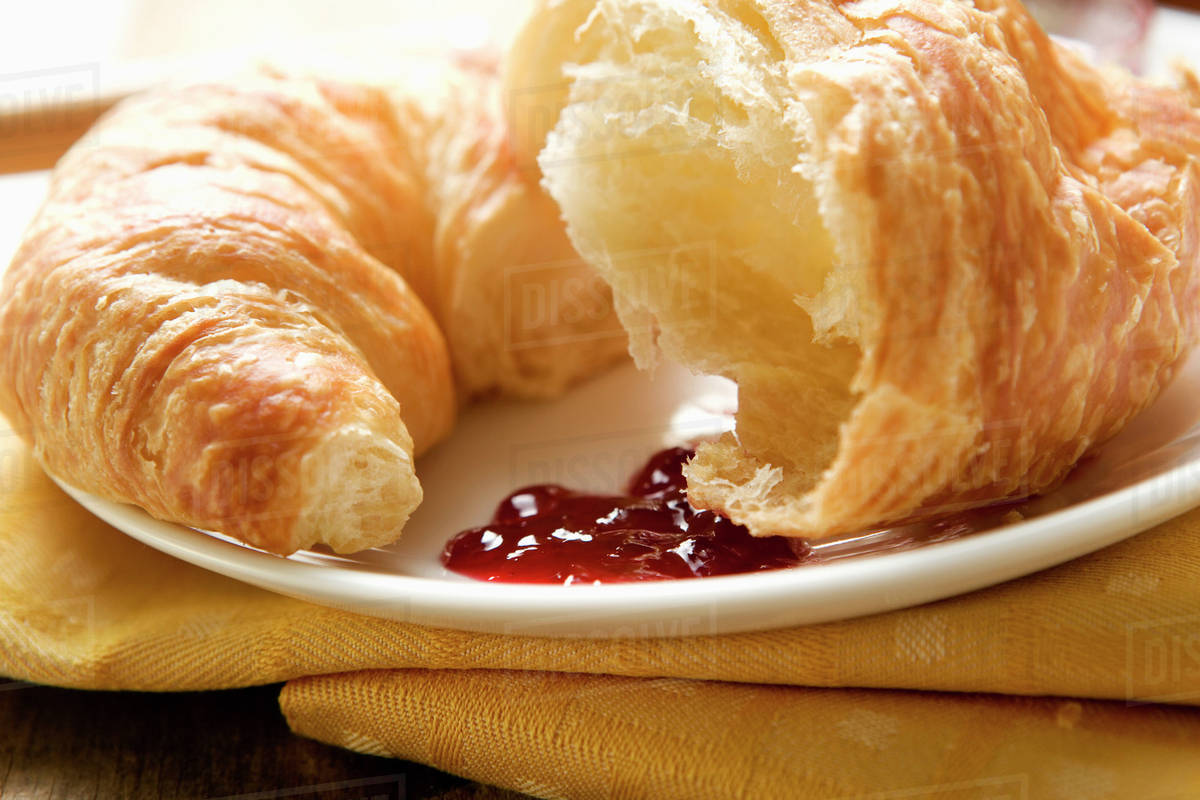 Croissant with jam on a plate - Royalty-free Stock Photo | Dissolve
