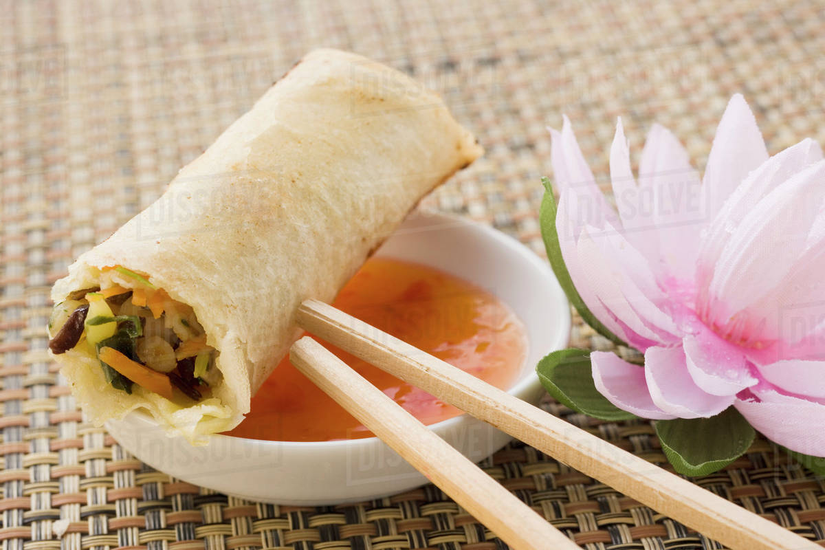 Spring roll on chili dip - Royalty-free Stock Photo | Dissolve