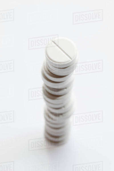 Stack of tablets on white background - Stock Photo - Dissolve