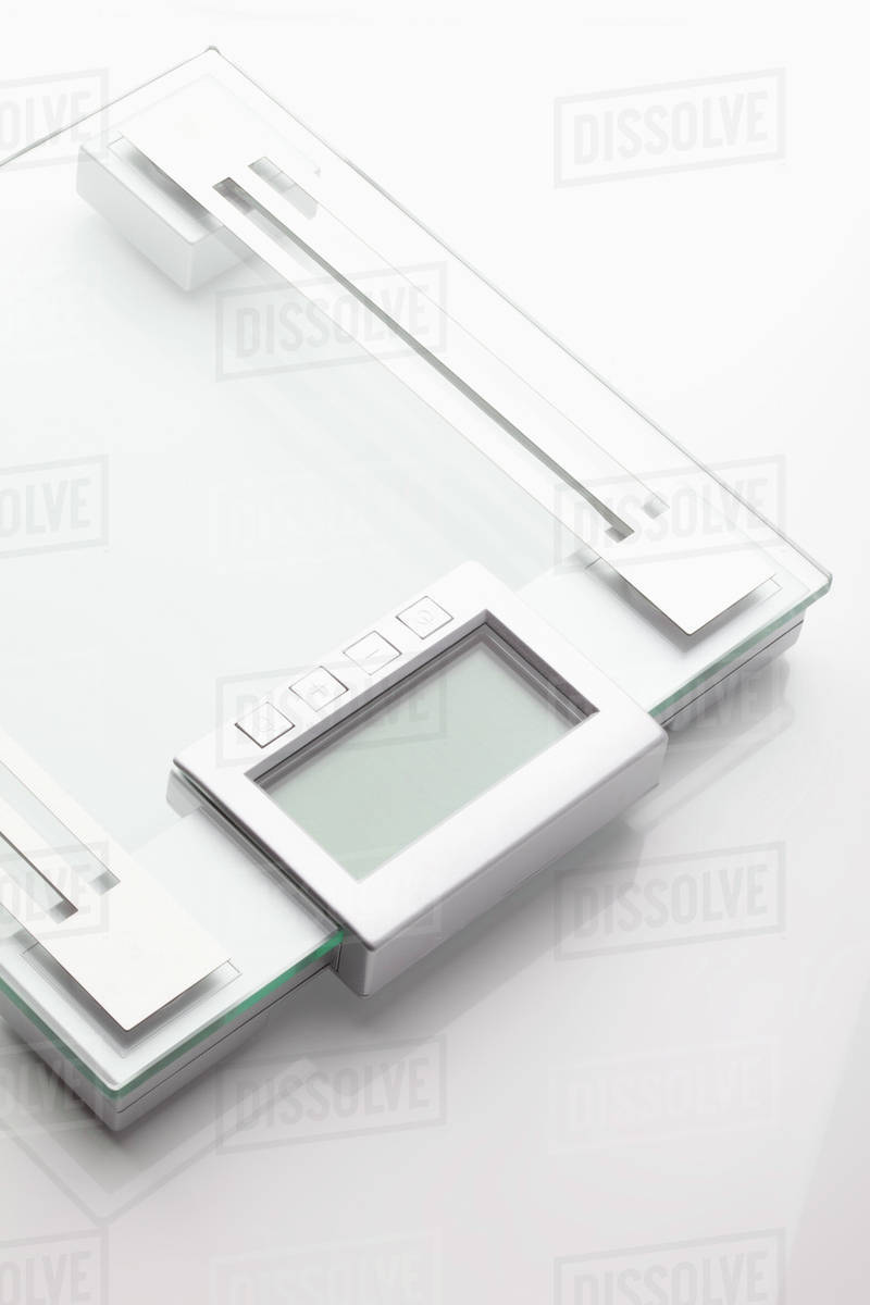 Scales on white background - Stock Photo - Dissolve