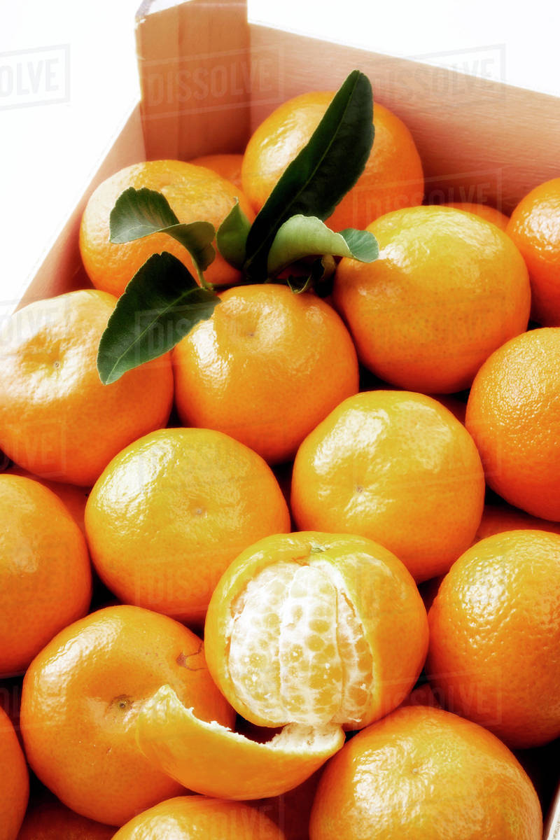 Box with tangerines - Stock Photo - Dissolve
