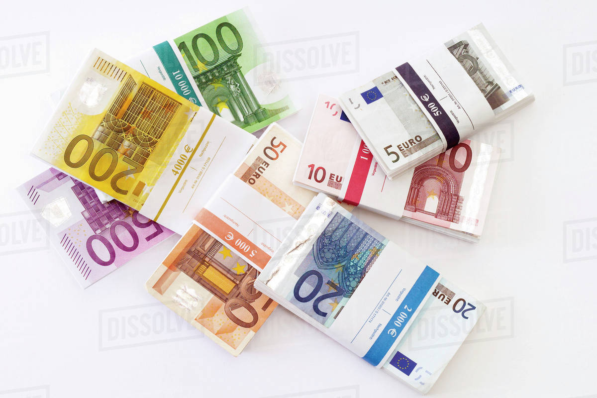 Bundle of euro banknotes, overhead view - Stock Photo - Dissolve