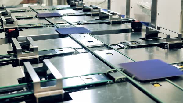 Factory conveyor with solar cells moving through it - 4K Royalty-free ...