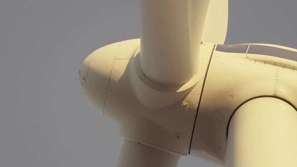 Wind mill turbines blades rotating generating power Extreme Close up ...
