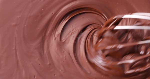 Mixing melt chocolate. Closeup shot. - 4K Royalty-free Stock Video ...
