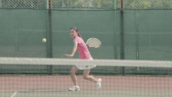 Young female tennis player in action on the court - Stock Video Footage ...