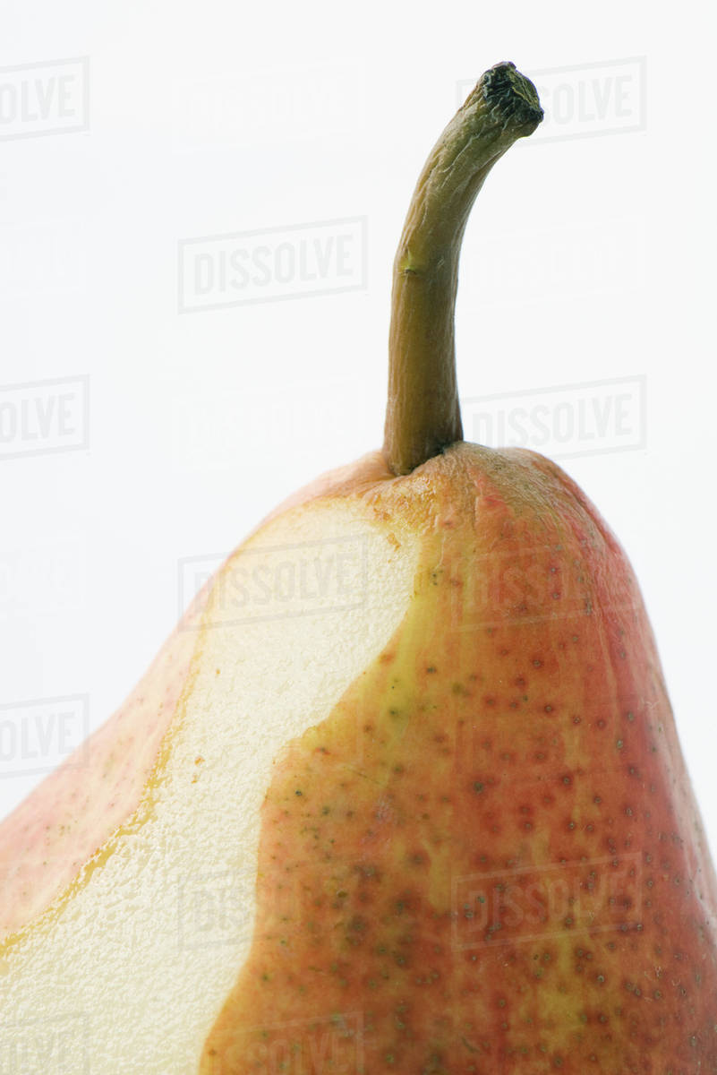 Fresh pear, partially peeled, close-up, cropped - Royalty-free Stock ...