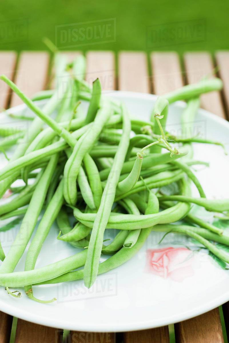String beans piled on plate - Royalty-free Stock Photo | Dissolve