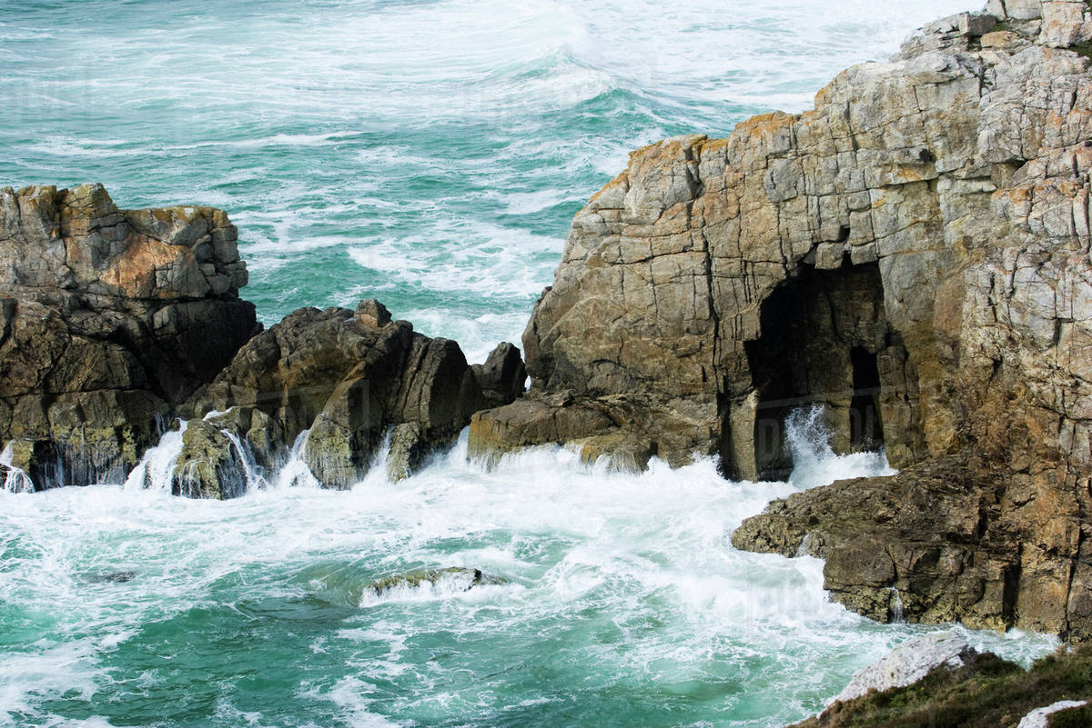 Waves crashing on coastal cliffs, Brittany, France - Stock Photo - Dissolve