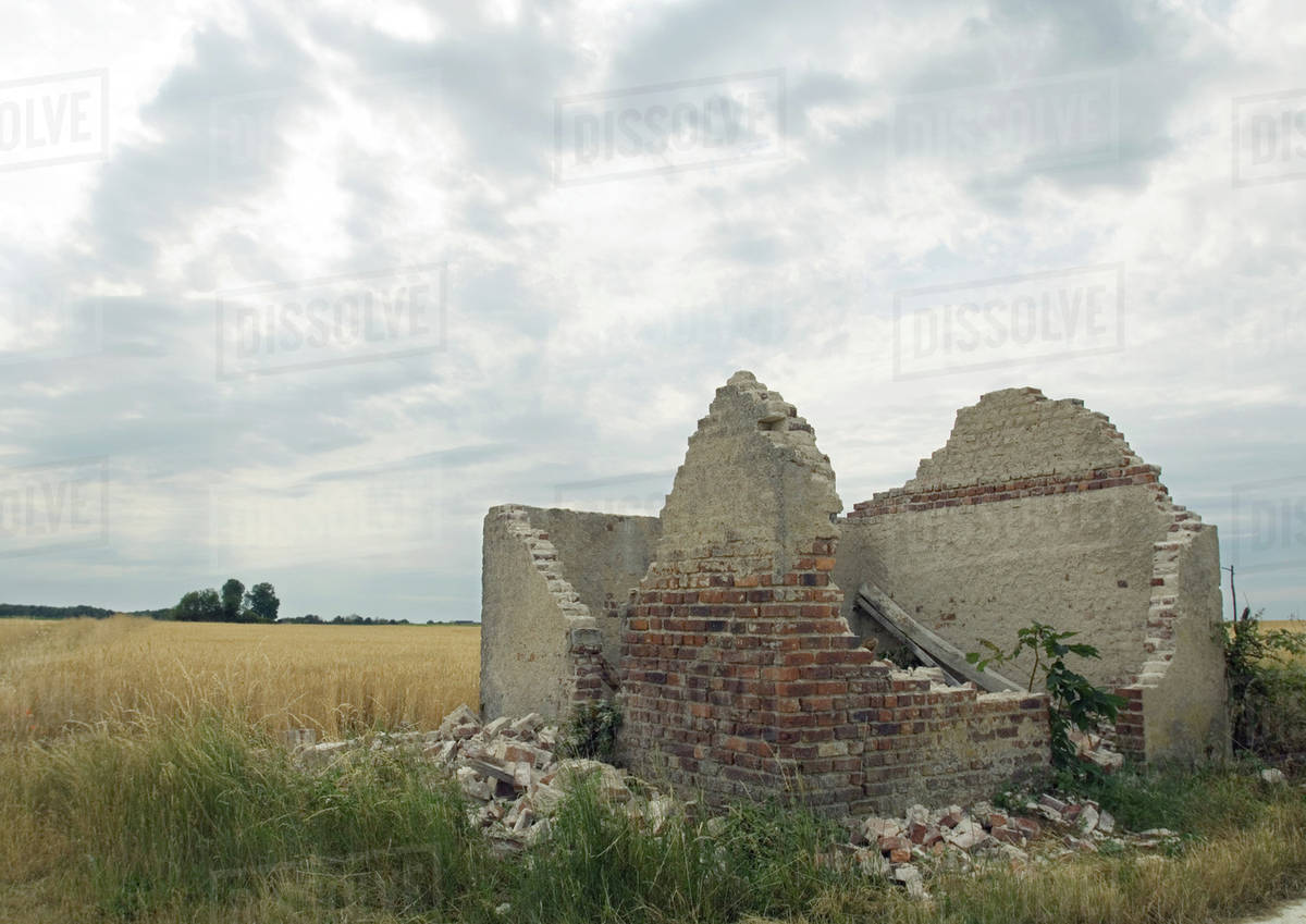 Brick building in ruins in countryside - Stock Photo - Dissolve