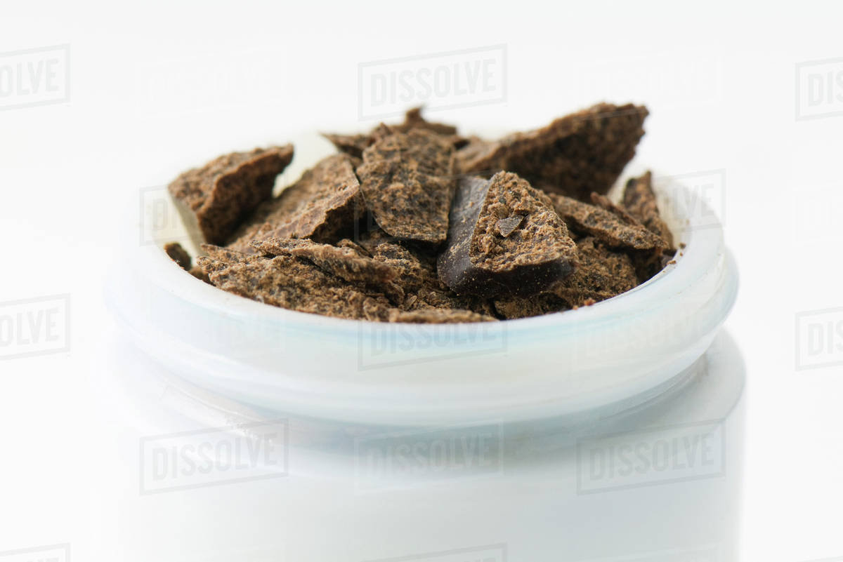Dark chocolate in small cosmetic container, close-up - Royalty-free ...