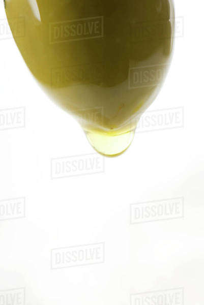 Olive dripping olive oil - Royalty-free Stock Photo | Dissolve