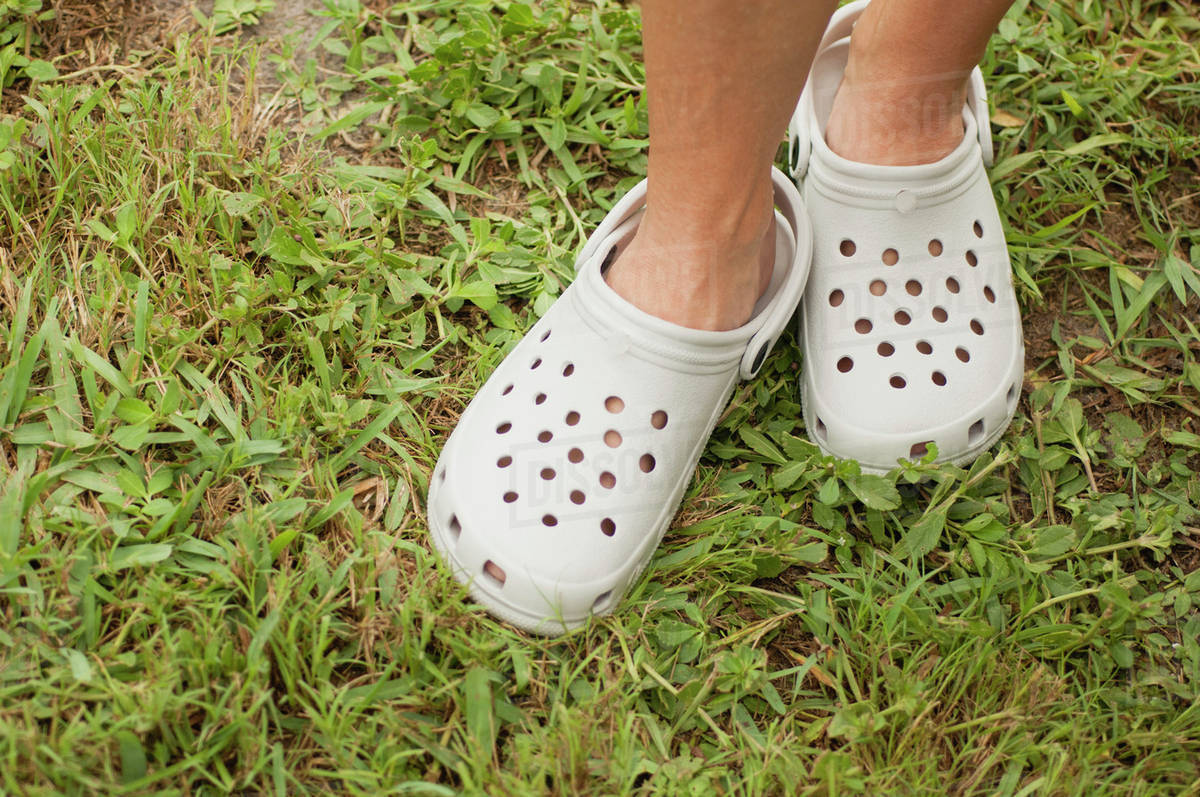 Woman wearing plastic gardening clogs, cropped - Royalty-free Stock ...