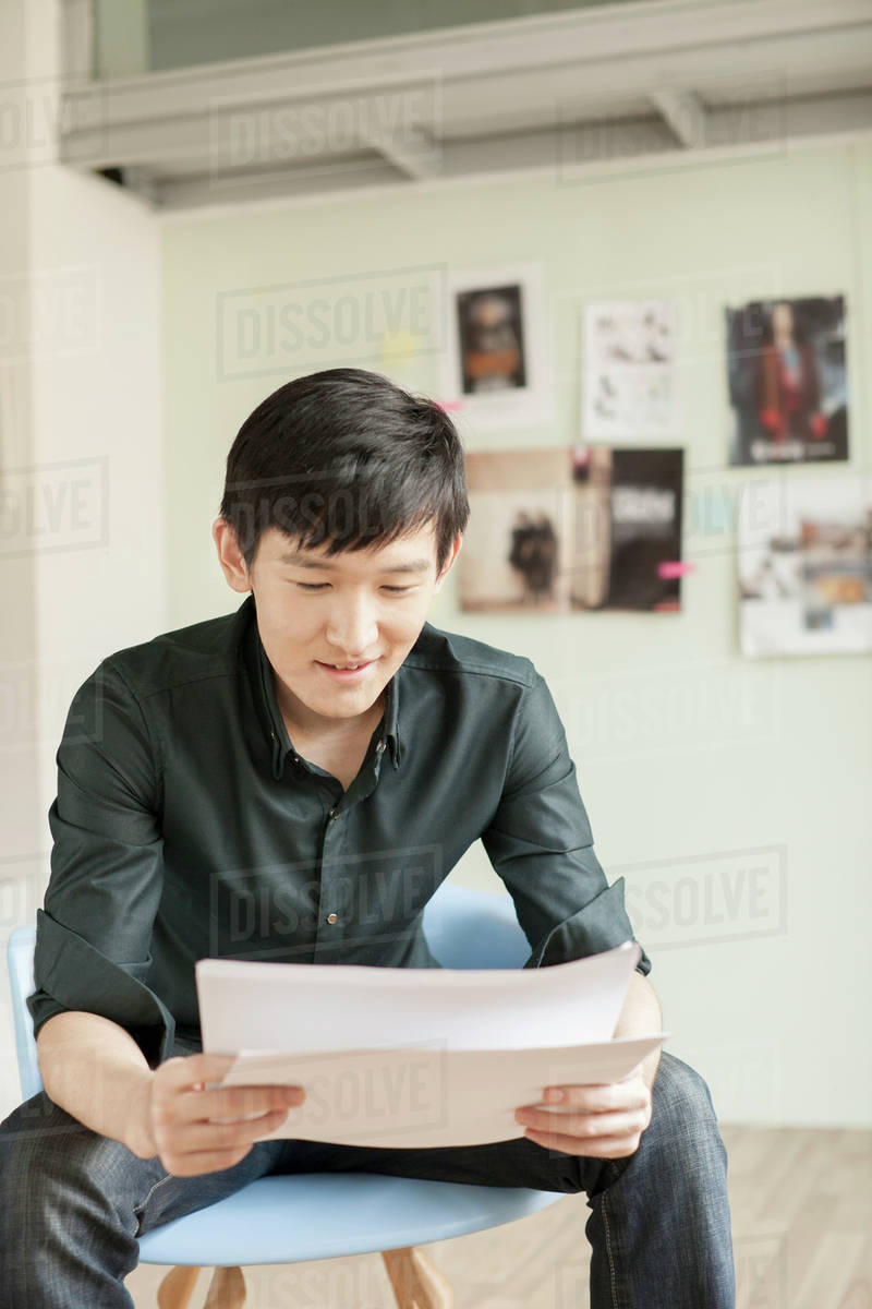 Professional Man Looking at Papers in Office - Royalty-free Stock Photo ...