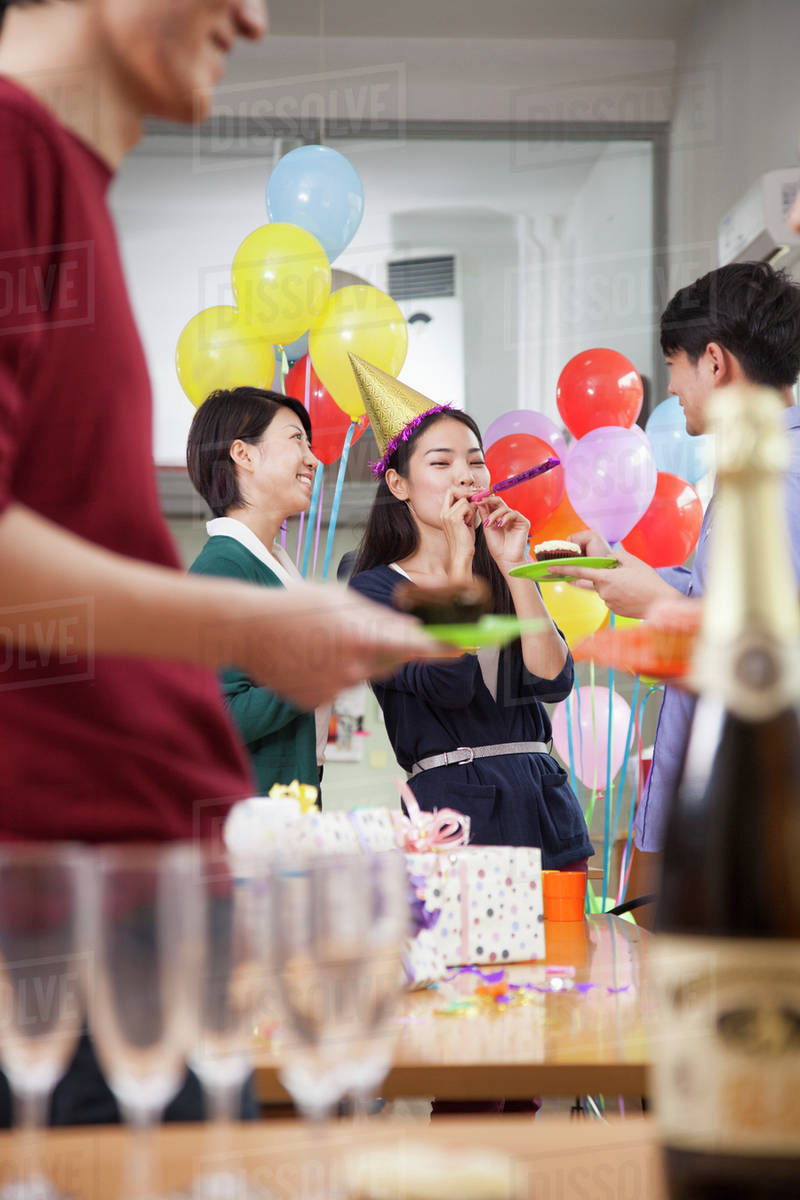 Colleagues Having Fun At Office Party - Royalty-free Stock Photo | Dissolve