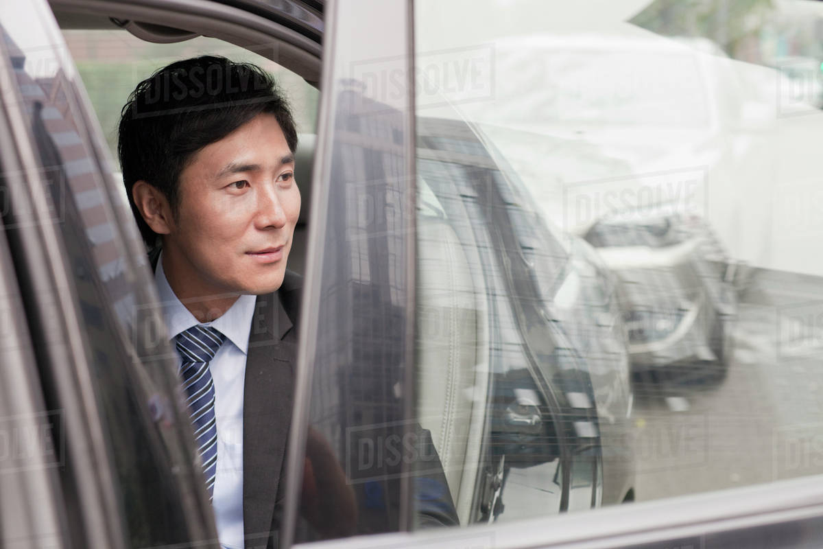 Businessman Leaving Car - Royalty-free Stock Photo | Dissolve