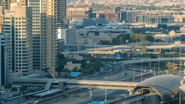 Futuristic building of Dubai metro and tram station and luxury ...