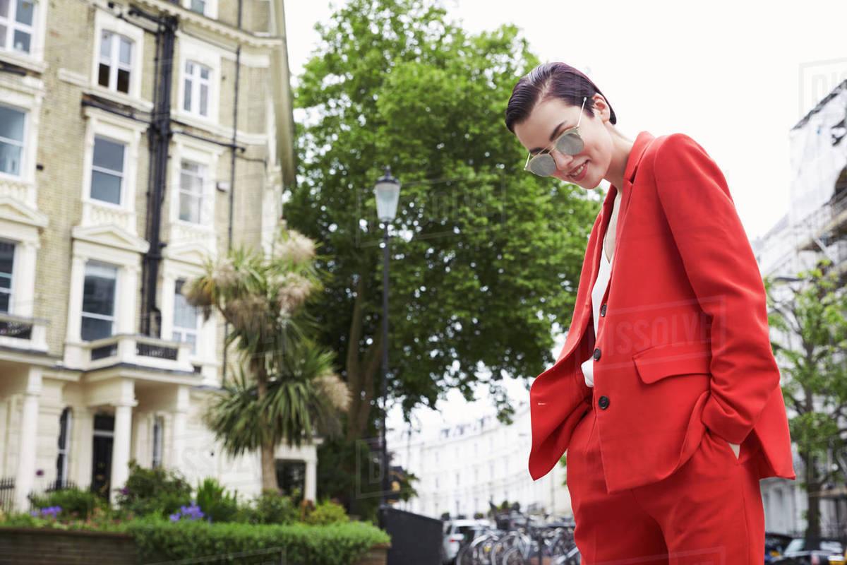 Chic woman in red suit in Notting Hill street, horizontal - Royalty ...