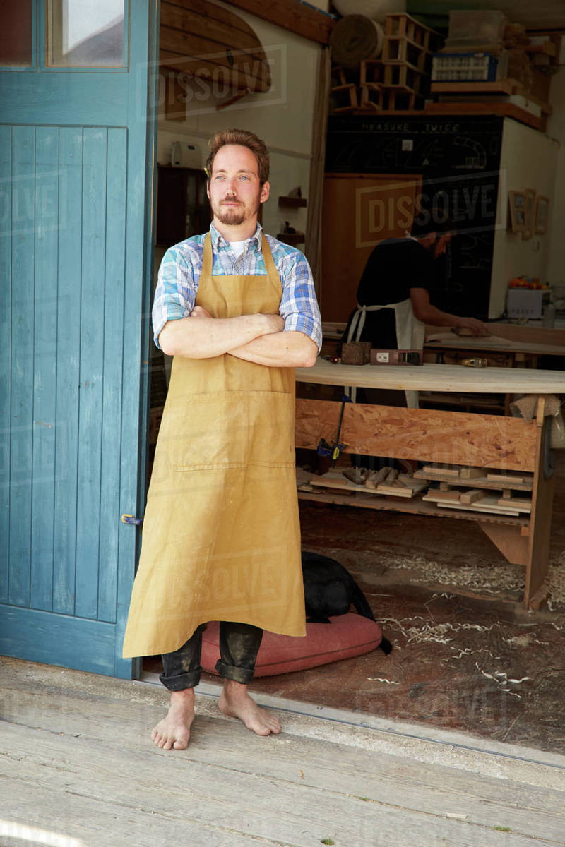 Portrait of carpenter outside bespoke surfboard workshop - Stock Photo ...