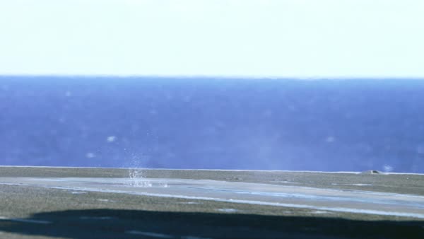 Tracking shot of a military submarine breaching surface - Stock Video ...