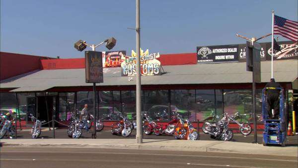 Zooming in shot of a custom motorcycle shop - Stock Video Footage ...