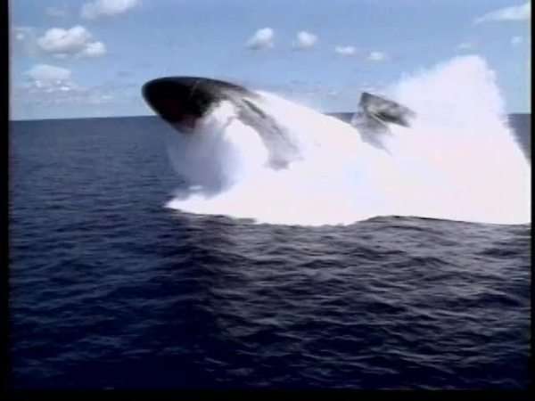 Tracking shot of a military submarine breaching surface - SD Rights ...