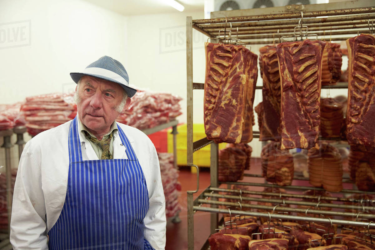 Butcher working in cold store - Royalty-free Stock Photo | Dissolve
