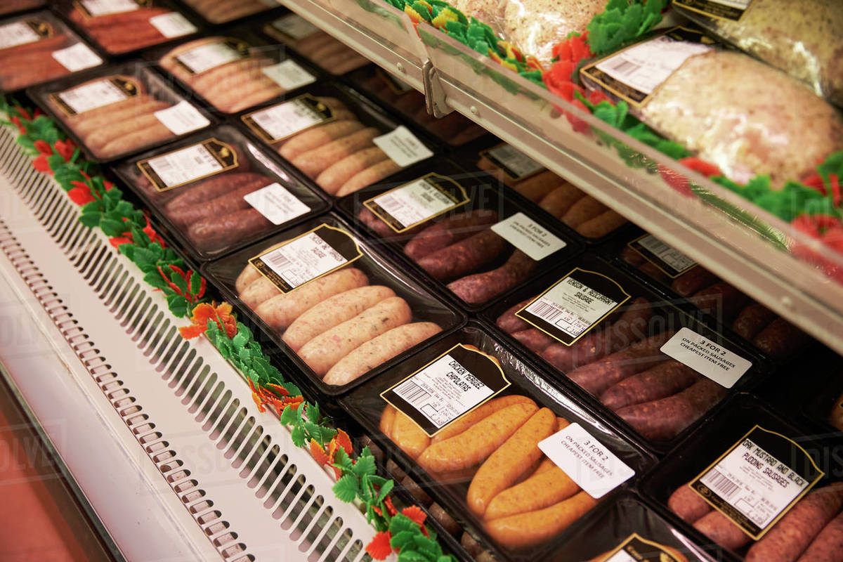 Packets of sausages in chilled display - Royalty-free Stock Photo ...
