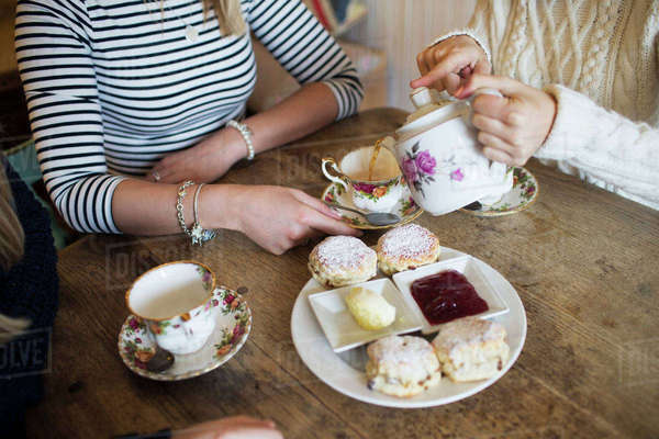 Table set for afternoon tea in café - Stock Photo - Dissolve