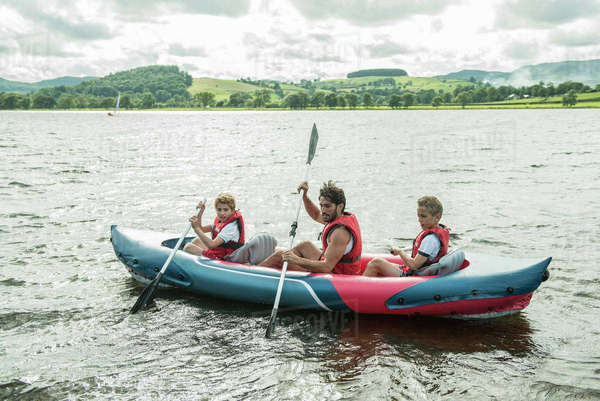 A man and two boys in a kayak on Bala Lake in Wales - Royalty-free ...