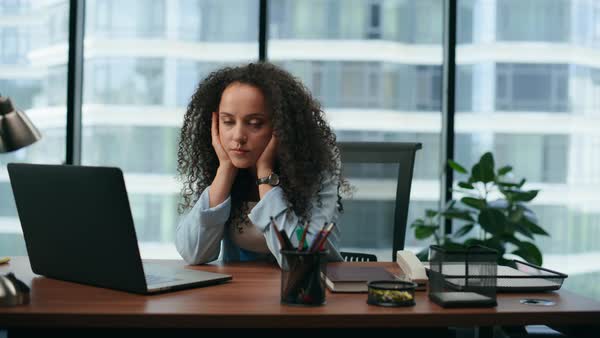 Woman feeling professional crisis sitting office desk close up. Girl ...
