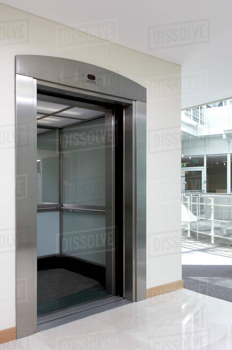 Empty lift with open doors, UK. - Stock Photo - Dissolve