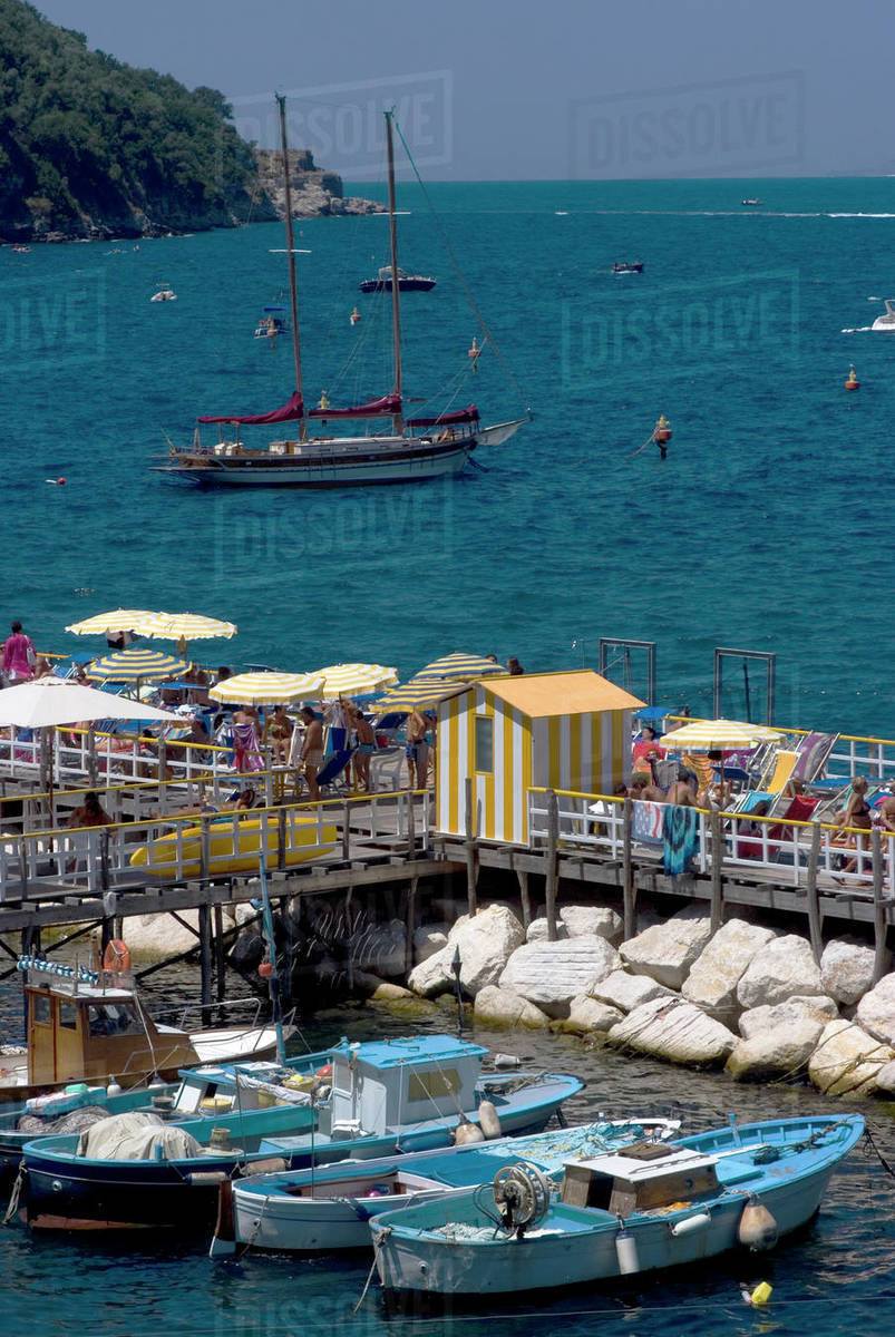 Umbrellas and chalets on the pier of a beach resort at the Marina ...